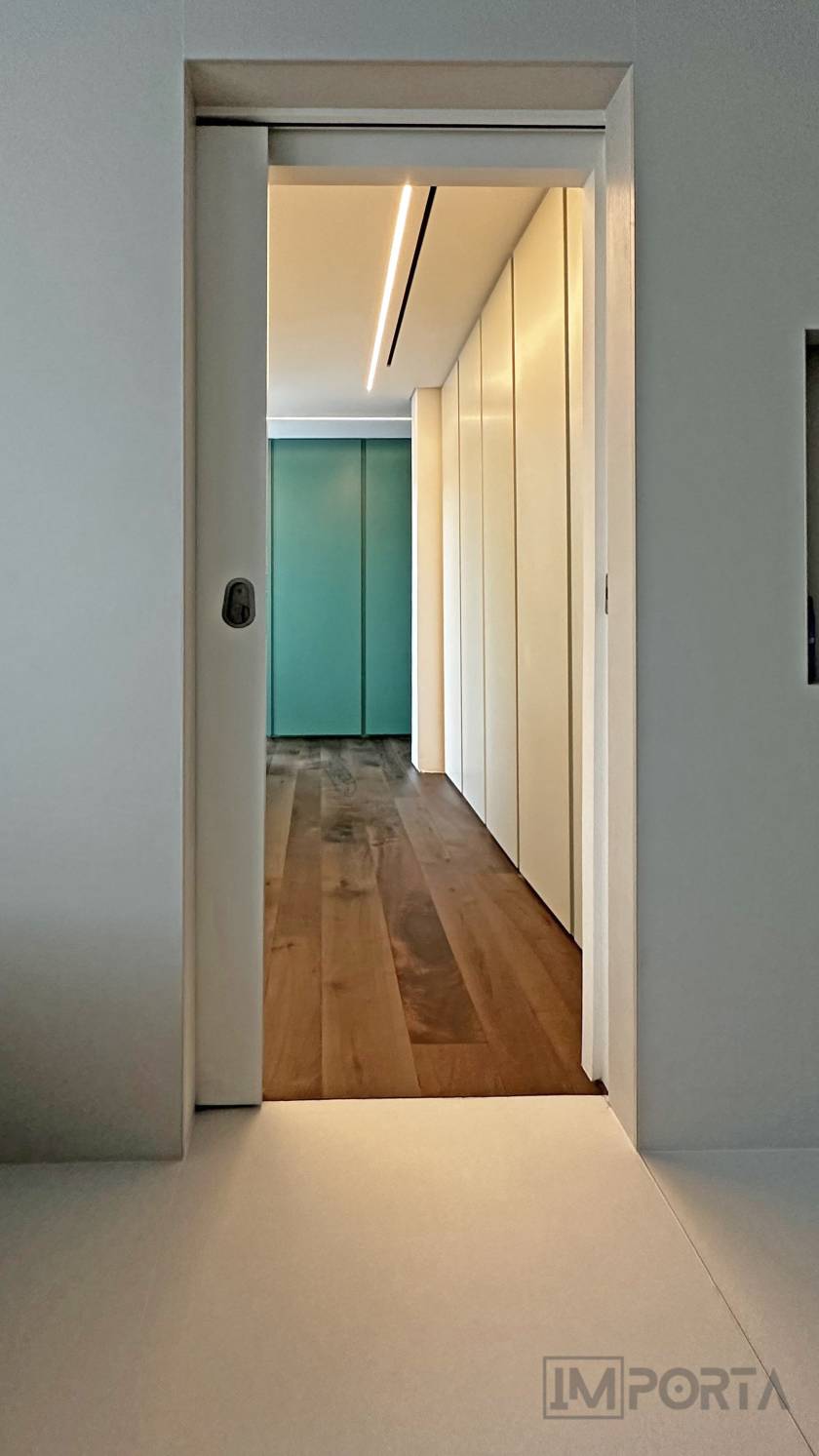 White sliding invisible doors Importa with white HPL in KSA & UAE - Importa